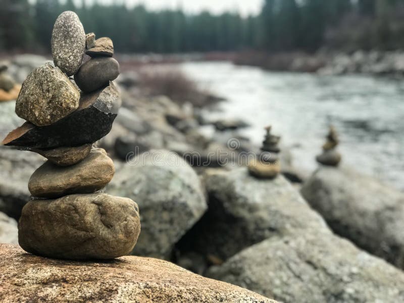 Rock Stacks Near River Lined with Pine Trees Stock Photo - Image of ...