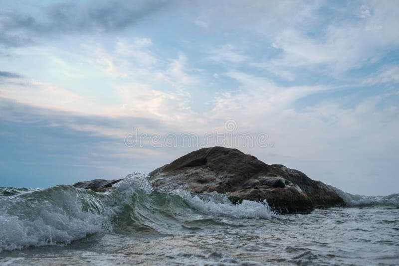 Rock Standing in the Sea Surrounded by Sea Waves Stock Image - Image of ...