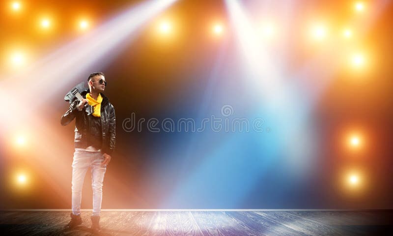 Rock star on stage stock photo. Image of guitar, rocker - 76855452