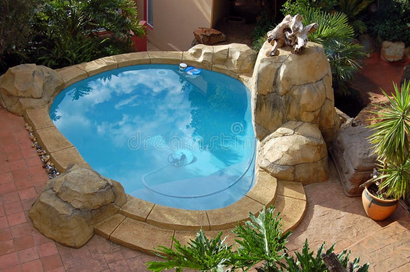 Rock Style Swimming Pool stock image. Image of lifestyle - 9369209