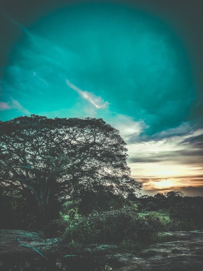 Rock on sunset stock image. Image of rock, blue, green - 183850633