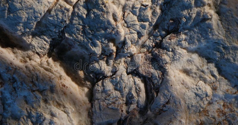 Rock Surface with Blue Shadows and Warm Sunlight Stock Photo - Image of ...
