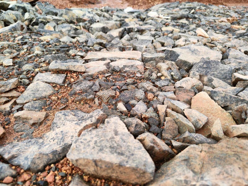 Rock texture on dirt road stock image. Image of bedrock - 228854717