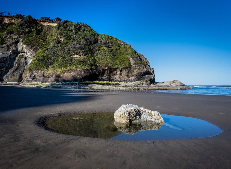 Rock in Tide Pool with View of Hug Point in Oregon Stock Photo - Image ...