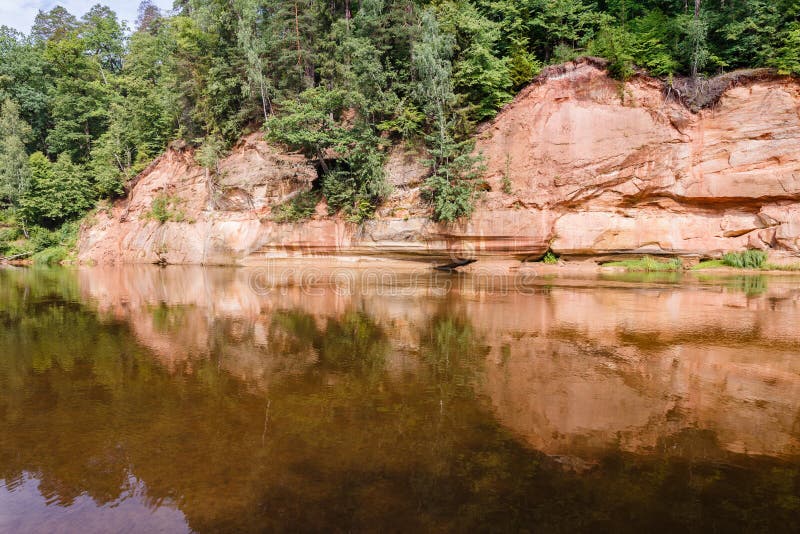 Rock and Tree Reflection in the Water Stock Image - Image of cliff ...