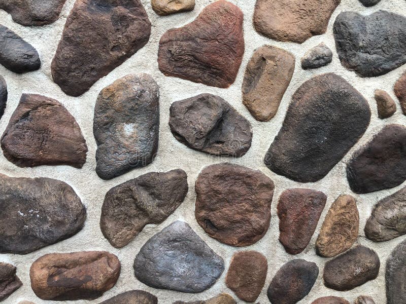 Rock wall with cement stock image. Image of strength - 176412783