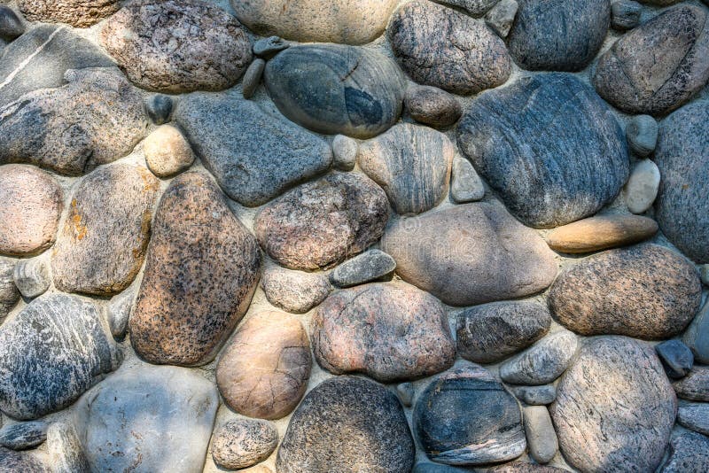 Rock Wall Made of Colorful River Rock, Sun Dappled, As an Abstract ...
