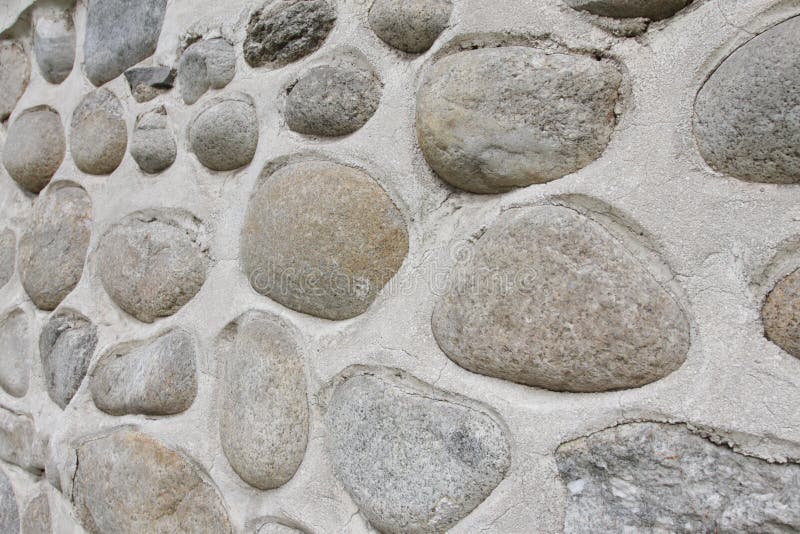 Rock Wall of Natural River Stones. Round Stones Wall Background. River ...
