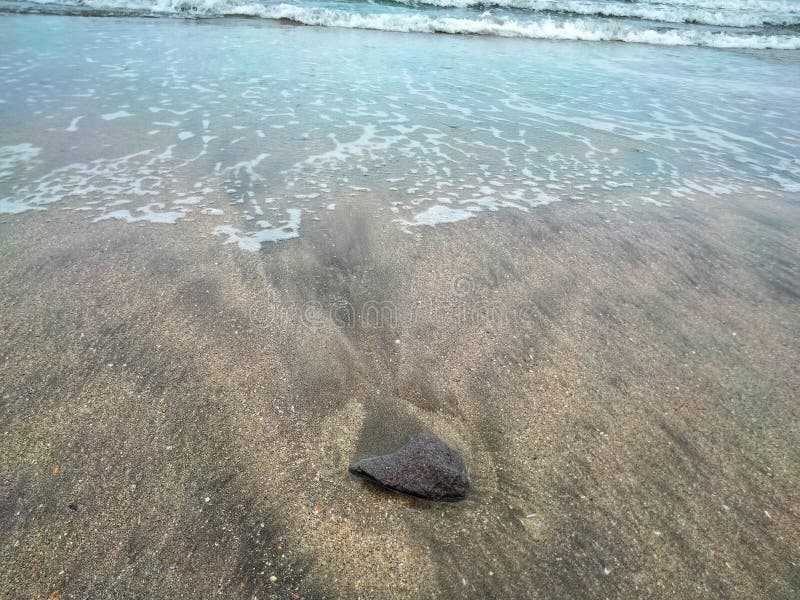 A Rock Washed Up on the Beach Stock Image - Image of heavy, silent ...