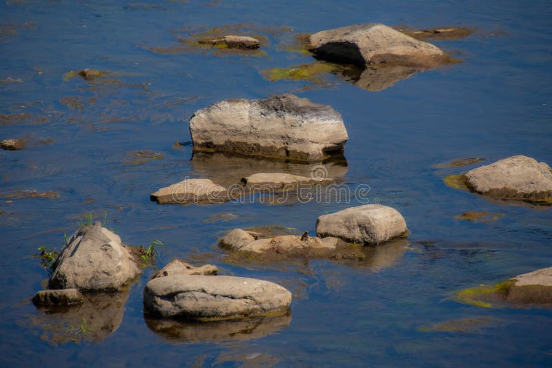 Stone at Water Level in a Beautiful River Stock Photo - Image of ...