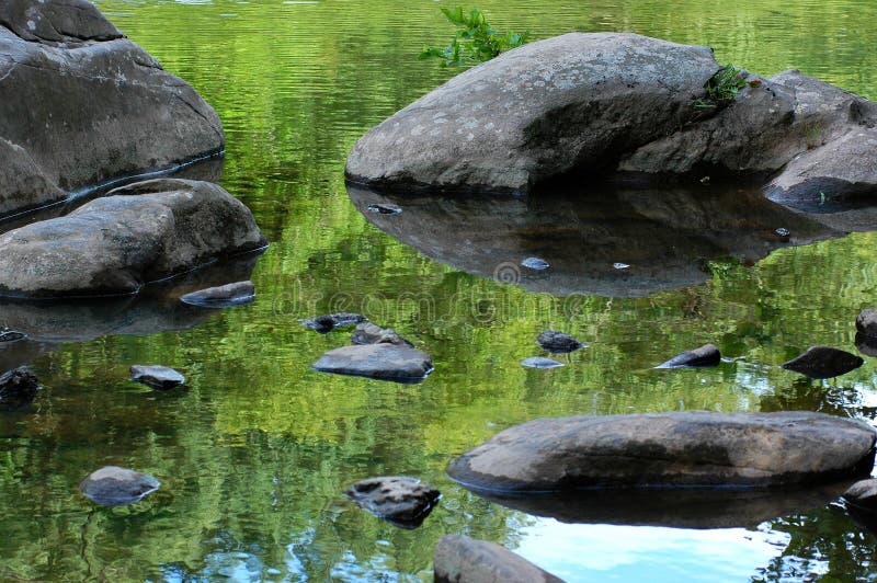 Rock, water, reflection stock image. Image of rock, hard - 499893