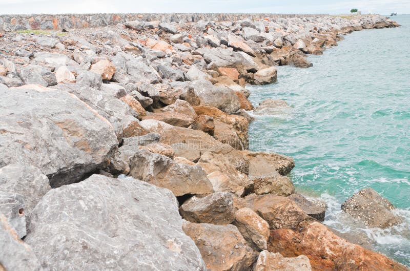 Rock wave barrier. stock photo. Image of coastline, background - 27311760