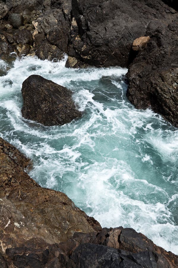 Rock and wave stock photo. Image of nature, tide, splashing - 129316212