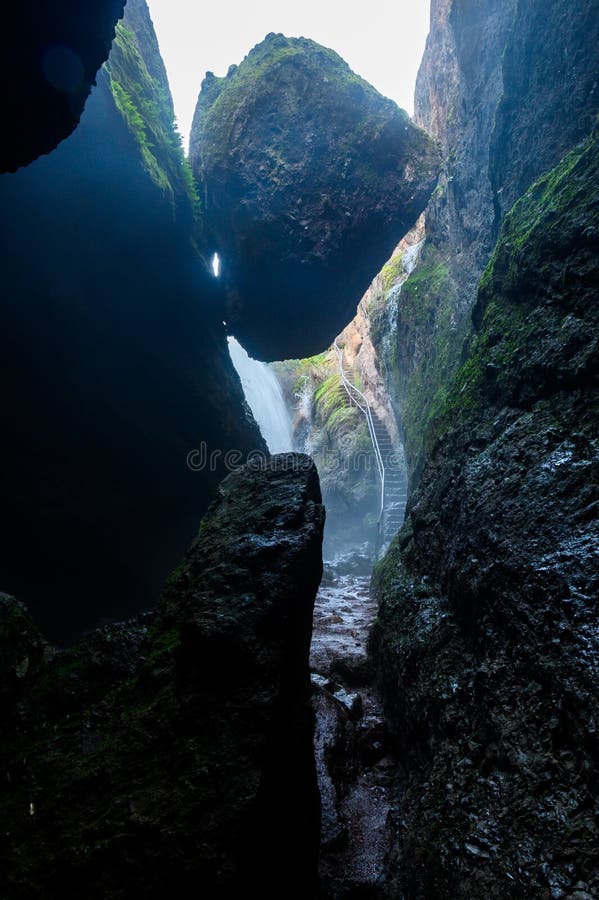 Rock Wedged Above Water Fall Stock Photo - Image of cave, steps: 147164310