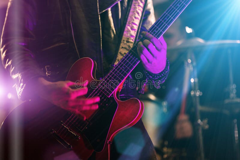 A Rocker is Playing Guitar on Stage. Stock Photo - Image of jazz ...