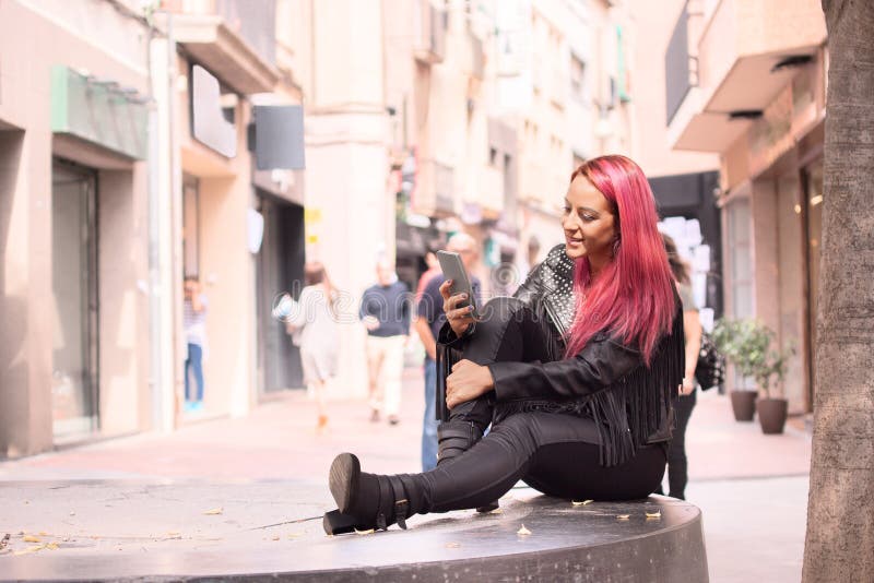 Rocker Woman Typing a Text Message on Mobile Stock Photo - Image of ...