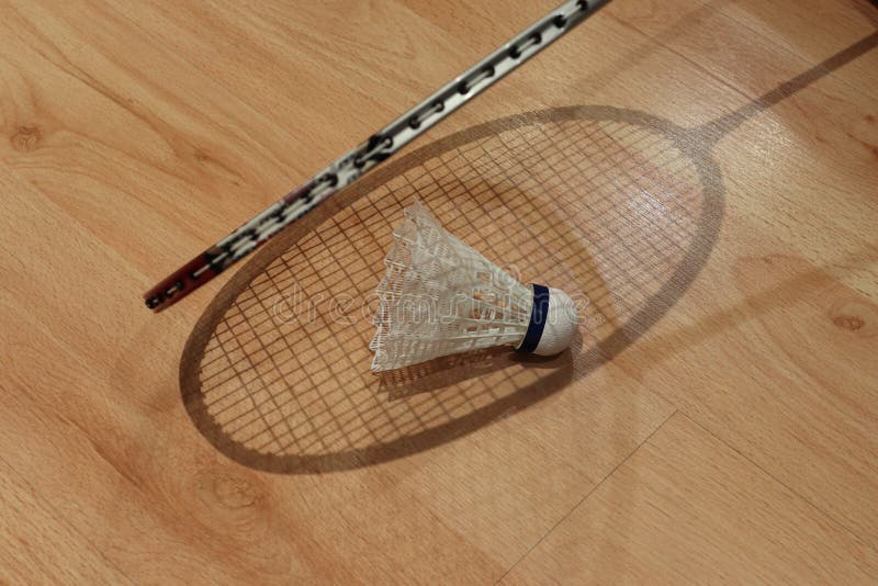 The Rocket Casts a Shadow on the Shuttlecock Lying on the Floor Stock ...