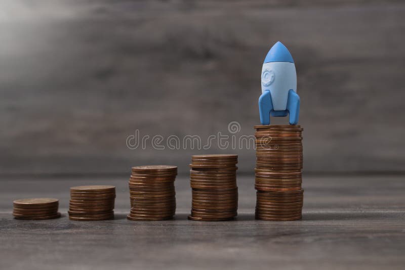 Rocket on Coins in the Form of a Graph Stock Image - Image of coins ...