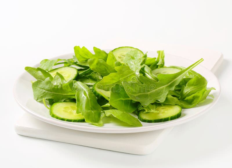 Rocket and cucumber salad stock image. Image of side - 56643827