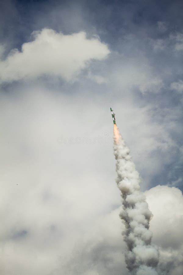 Rocket Fire in cloudy sky stock image. Image of bomb - 152598379