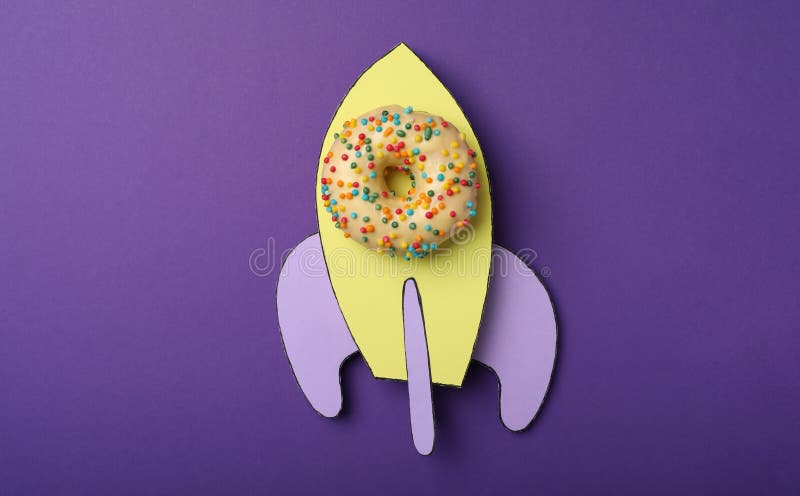 Rocket Made with Donut and Paper on Background, Top View Stock ...