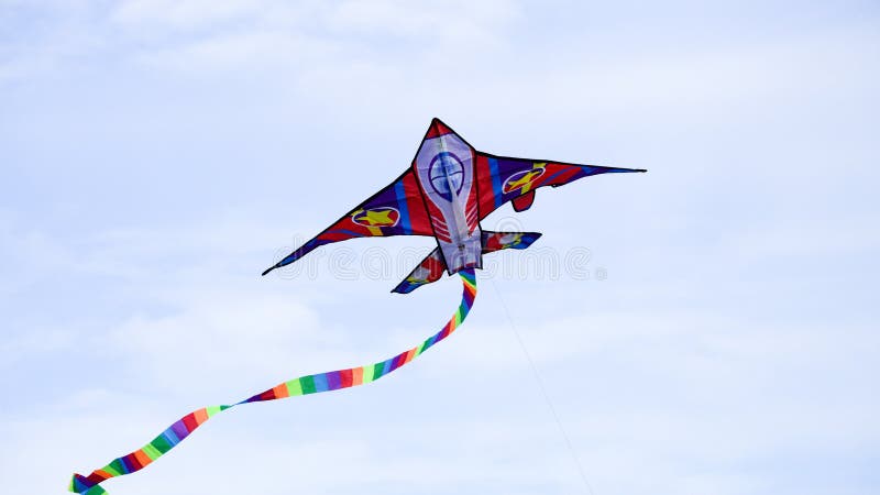 Rocket Shaped Kite Flying High in the Blue Sky Stock Image - Image of ...