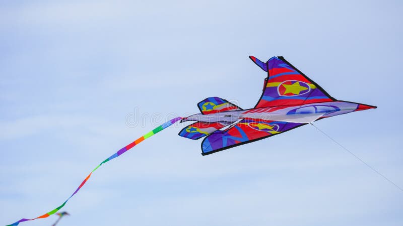 Rocket Shaped Kite Flying High in the Blue Sky Stock Image - Image of ...