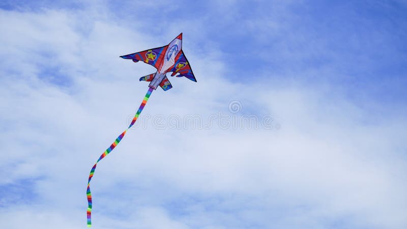 Rocket Shaped Kite Flying High in the Blue Sky Stock Image - Image of ...