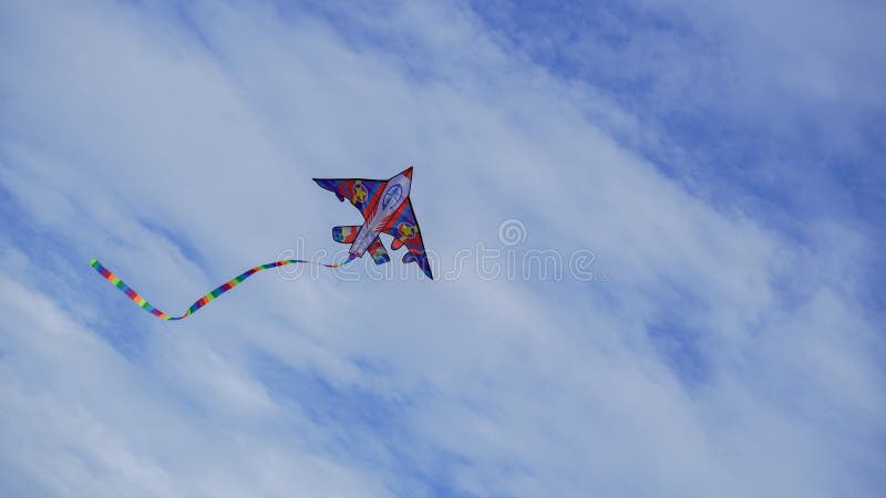 Rocket Shaped Kite Flying High in the Blue Sky Stock Photo - Image of ...