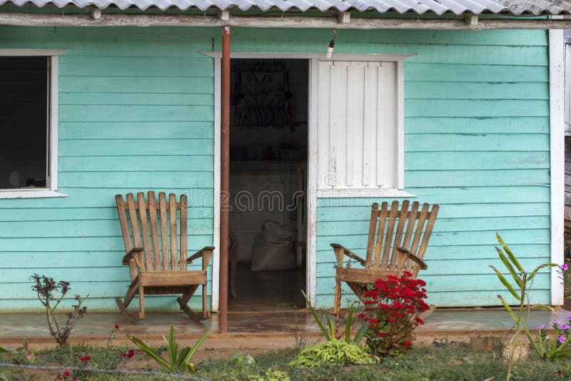 Rocking Chairs in Front of a Home Stock Photo - Image of door, small ...