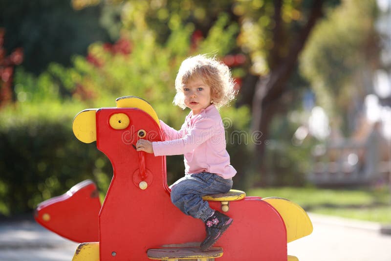 Child on rocking-horse stock image. Image of happiness - 3290837