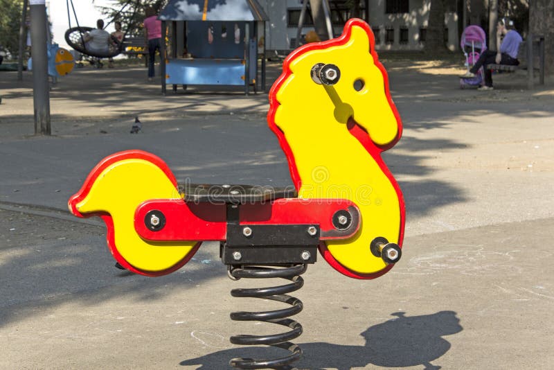 Rocking horse in the park stock photo. Image of seat - 56865898