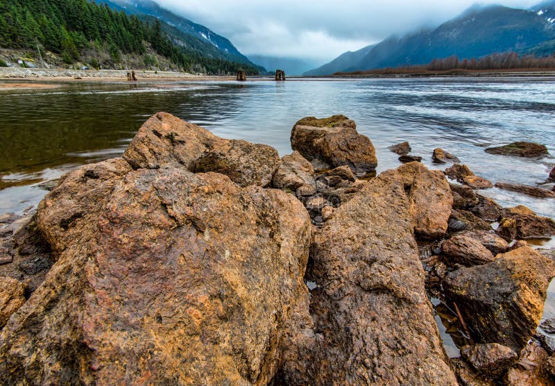 Rocks Along Shore of Lake stock photo. Image of moody - 34613786