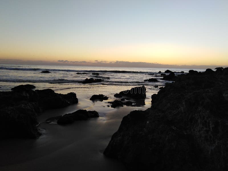 Rocks Amongst the Waves at the Beach at Sunrise Stock Image - Image of ...