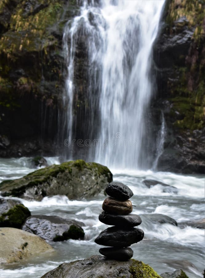 Rocks Balanced in Front of a Waterfall Stock Photo - Image of balance ...