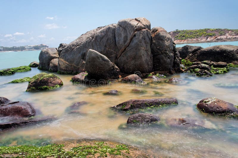 Rocks at the Beach stock image. Image of tropical, latin - 13063545