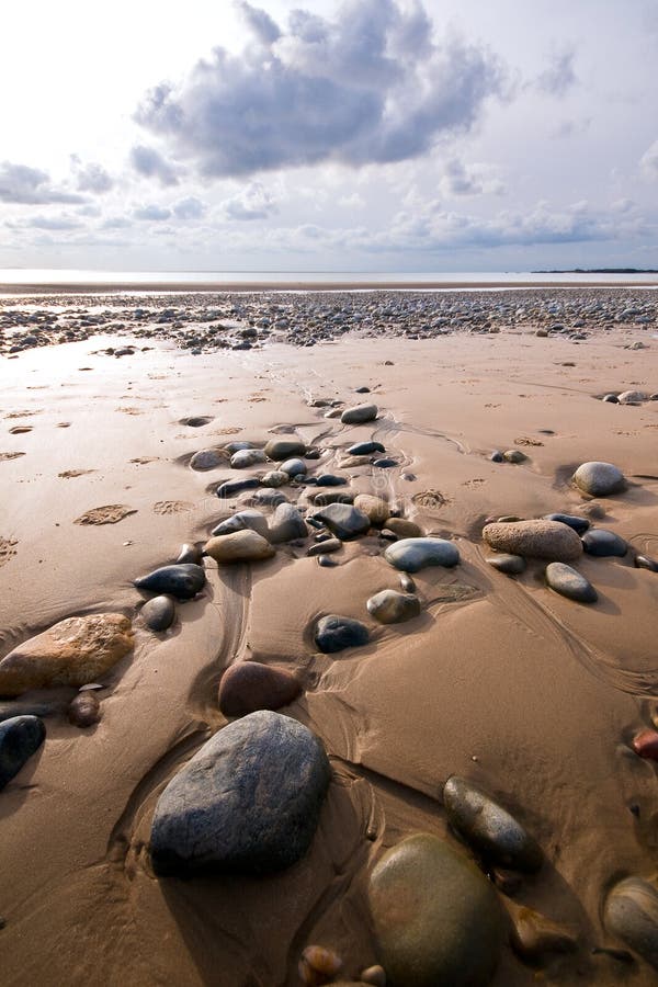 Rocks on the beach stock image. Image of sand, ripples - 17466455