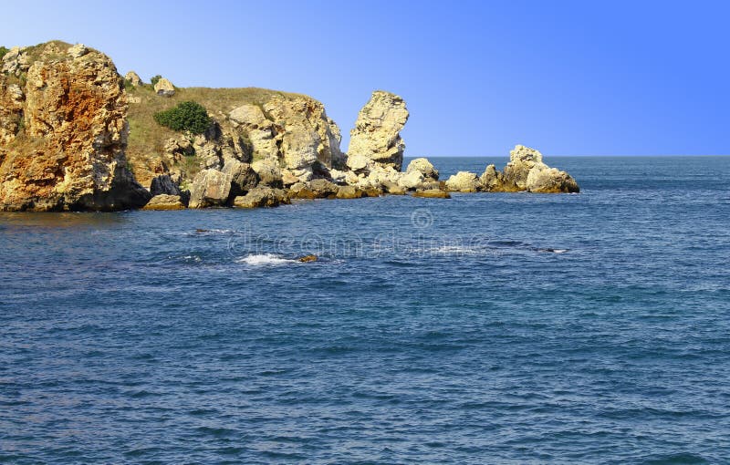 Rocks on the beach stock image. Image of peaceful, water - 20737641
