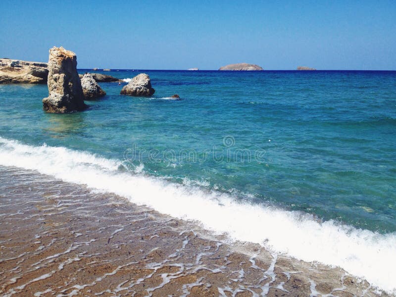 Rocks on beach stock image. Image of water, blue, ocean - 44556533