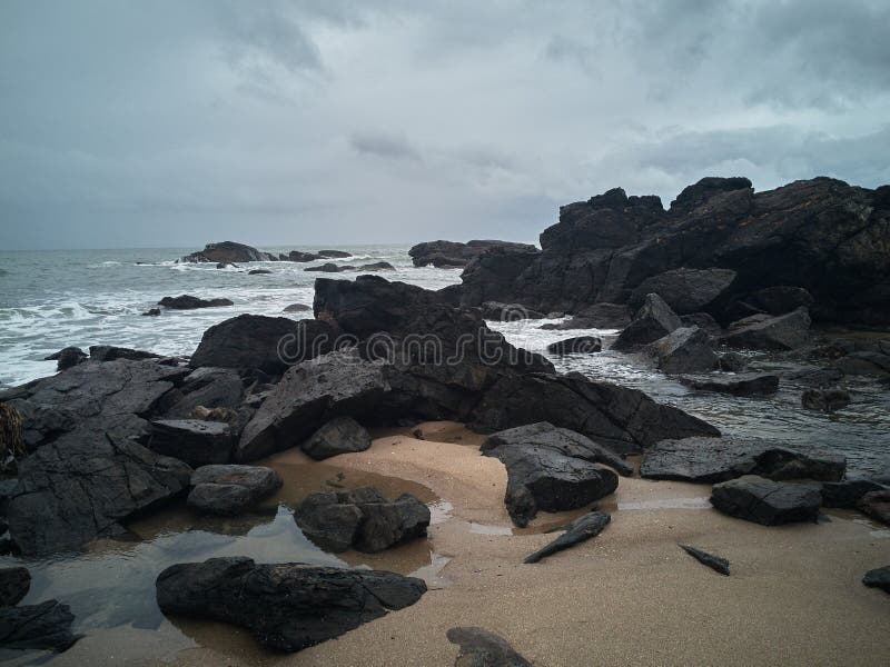 Rocks on the Beach after the Storm Stock Photo - Image of blue, light ...