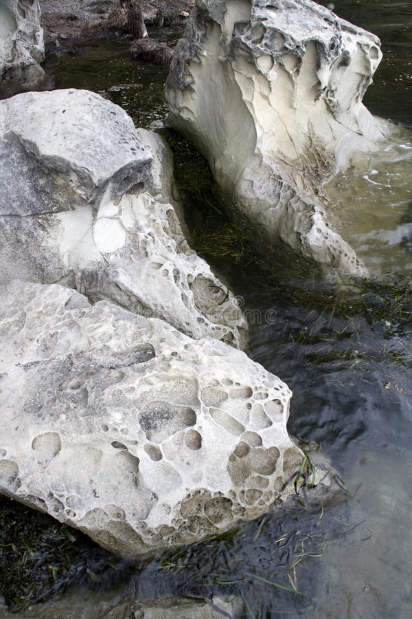 Rocks on a Beach stock photo. Image of rough, shapes - 61396018