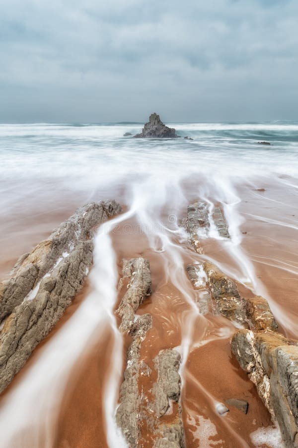 Rocks in the beach stock image. Image of rock, beach - 70340663