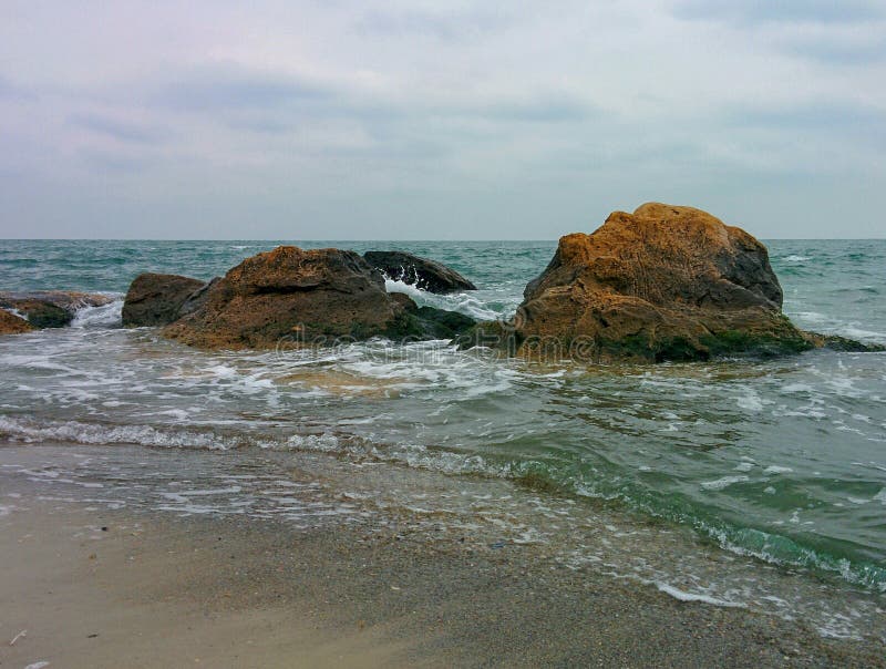 Rocks on beach stock photo. Image of beach, seascape - 79081830