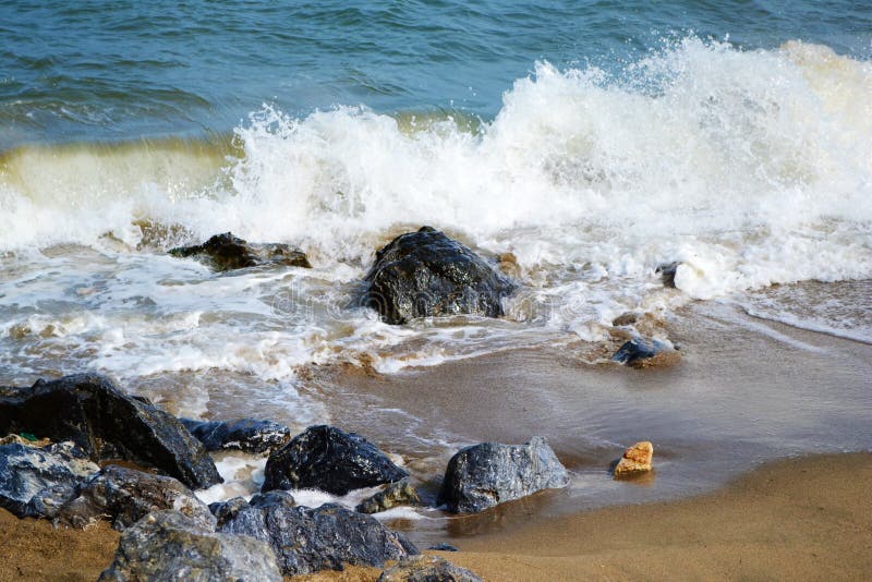 Beach waves stock photo. Image of blue, splash, rocks - 115673112