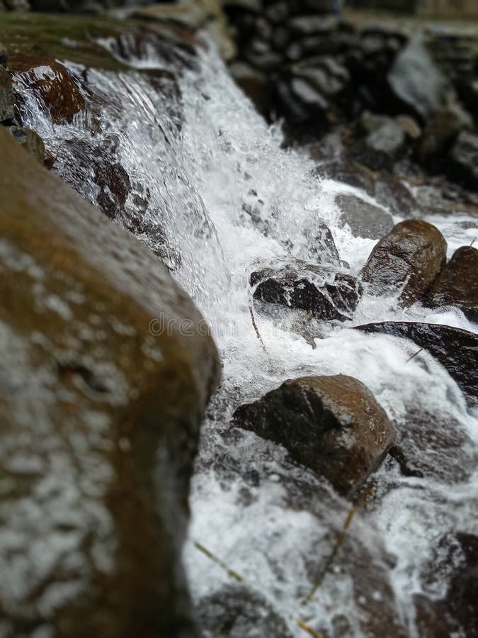 Rocks Beneath the Stream. stock image. Image of wave - 261842215