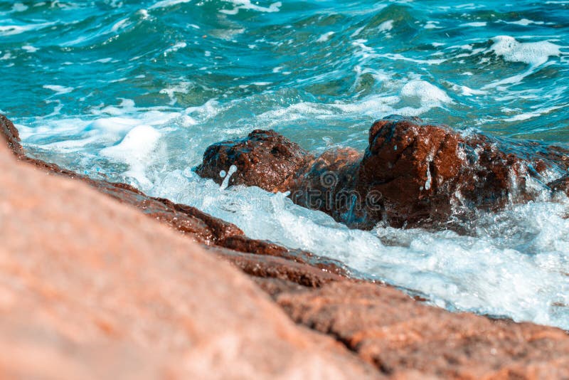 Rocks in the blue sea stock photo. Image of marine, rocky - 127712622