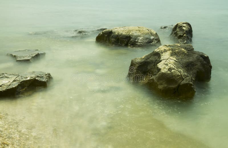 Rocks in blur water stock image. Image of wave, water - 43978701