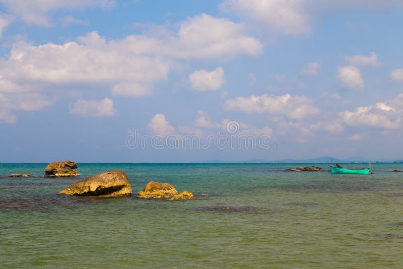 Rocks and a boat stock image. Image of island, boat, clear - 39042237