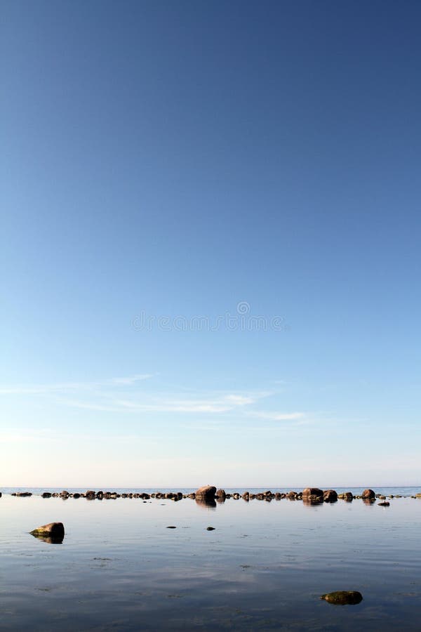 Rocks on calm waters stock photo. Image of rock, reflect - 36473656