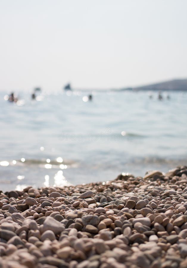 Rocks on the Coast. People Bathe in the Sea Stock Photo - Image of blue ...